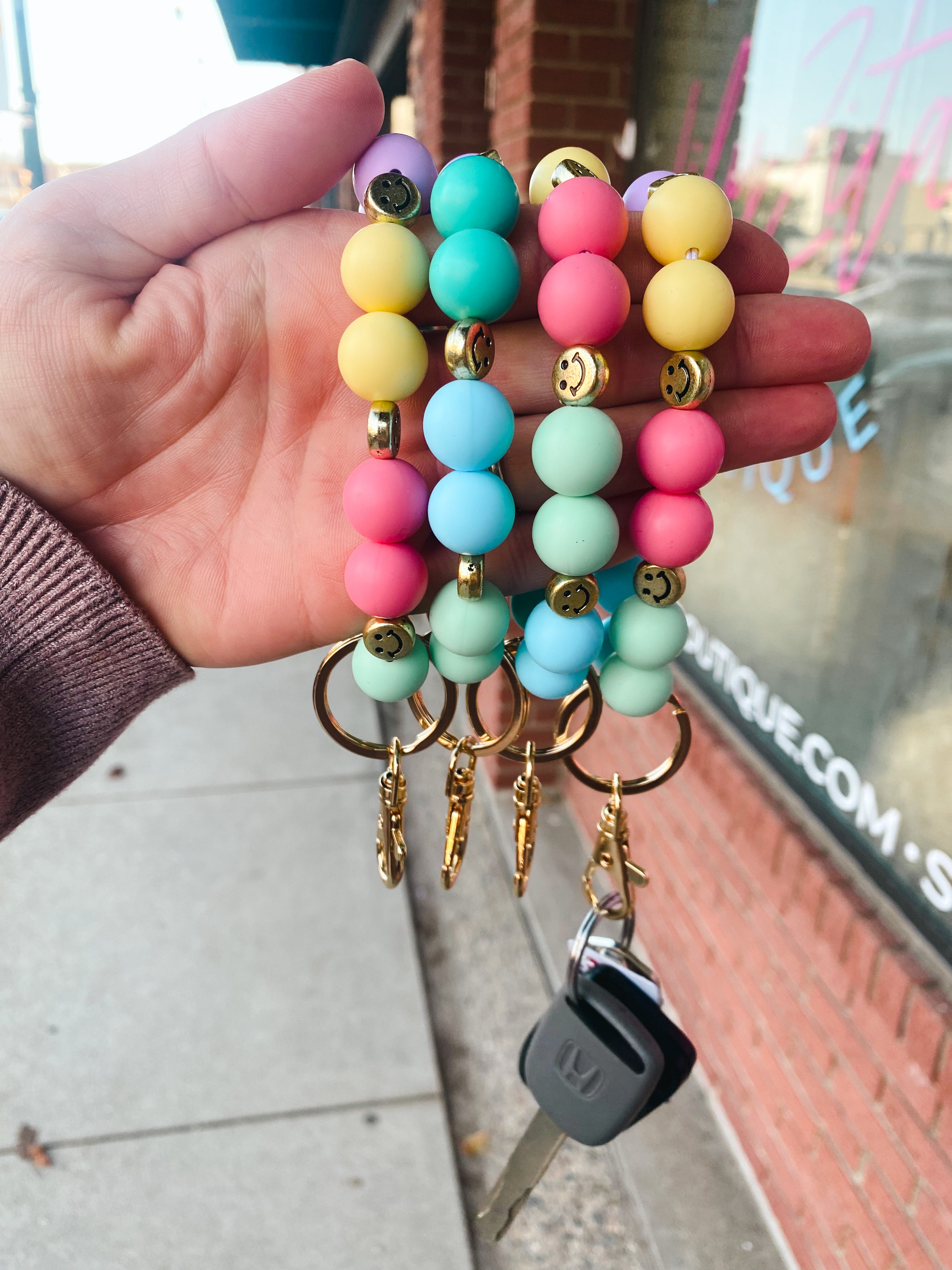 Happy face silicone stretchy wrist keychain – Sugar-N-Spice Children's ...